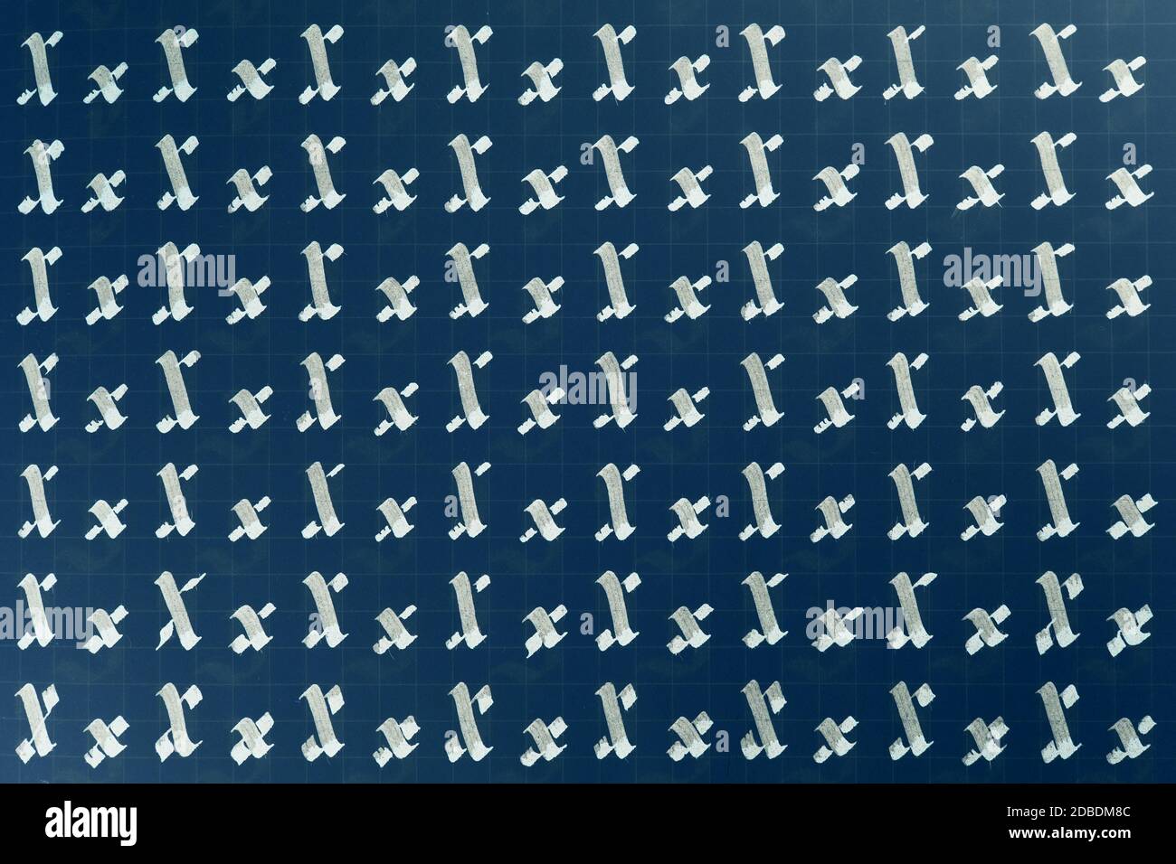 Calligraphic white on dark blue letter X learning skills paper page ...