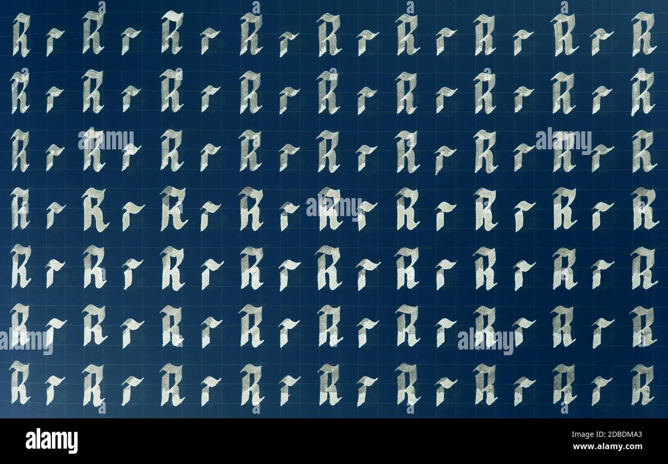 Calligraphic white on dark blue letter R learning skills paper page ...