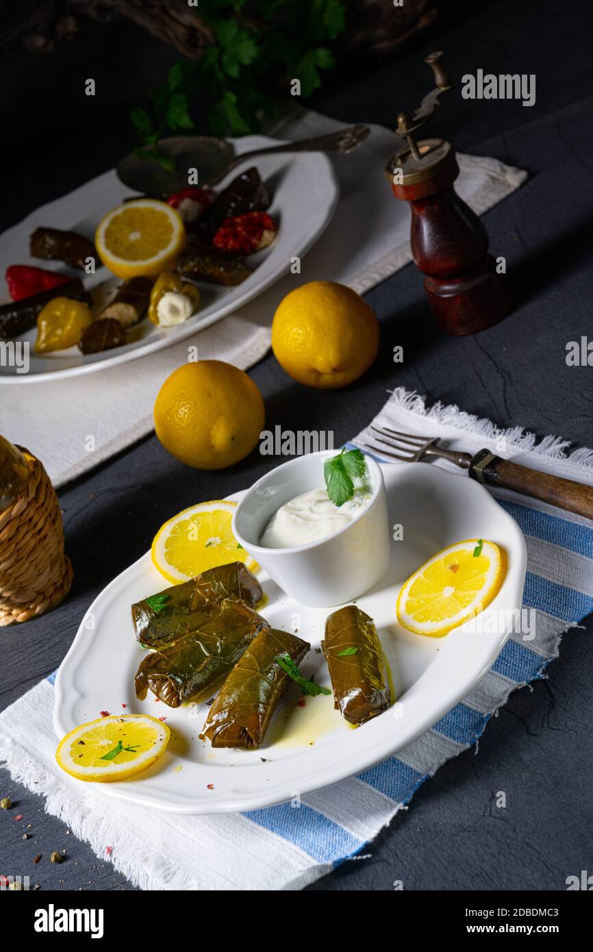 Dolmades - stuffed grape leaves the Greek way Stock Photo - Alamy