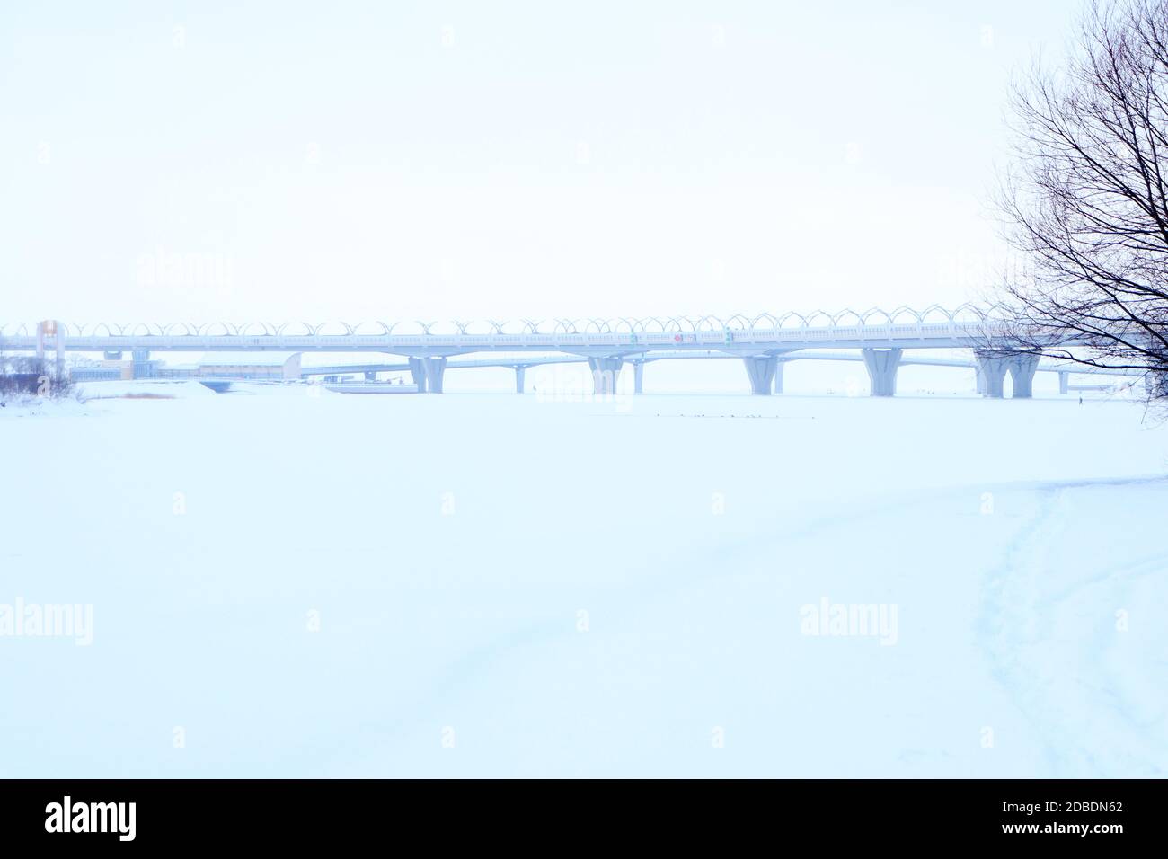 Big bridge on the horizon of the snowy gulf Stock Photo - Alamy