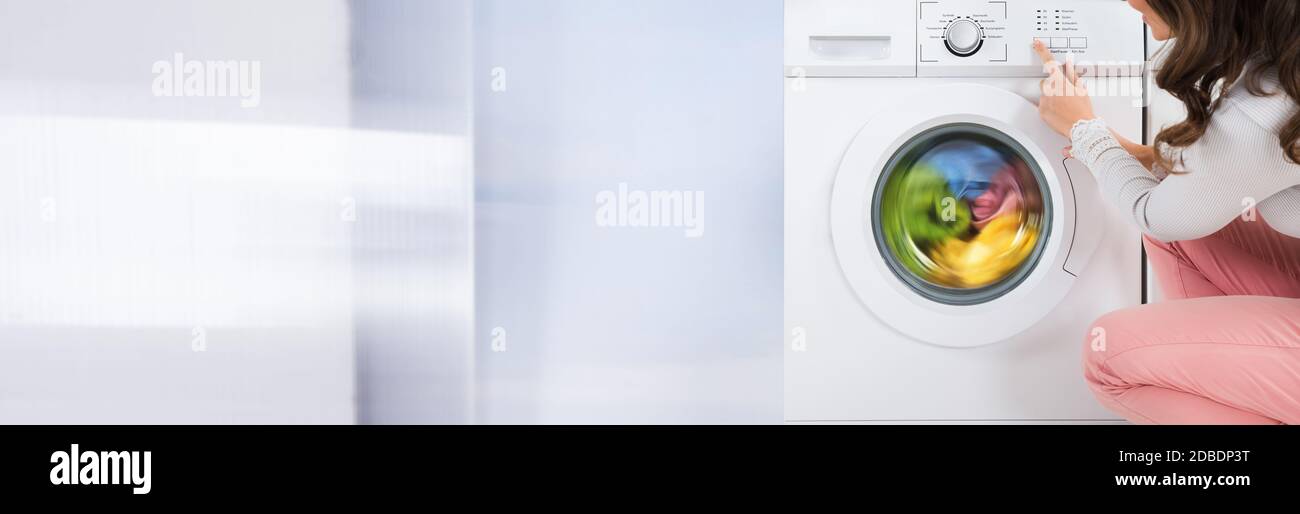 Clothes Wash In Washing Machine Or Dryer. Woman Doing Laundry Stock ...