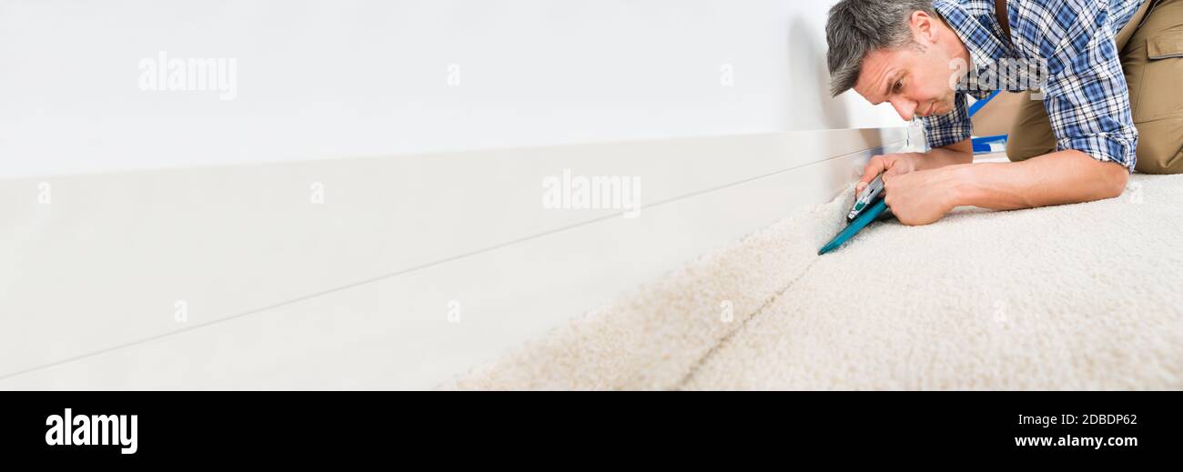 Carpet Floor Installation. Fitting And Laying Carpet Stock Photo - Alamy
