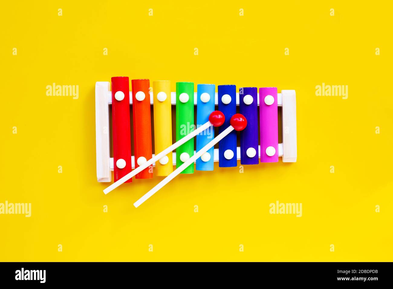 Colorful xylophone on yellow background Stock Photo - Alamy