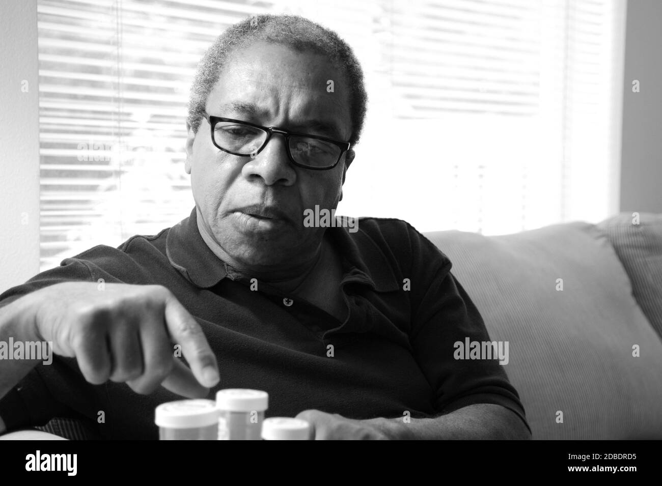 Man taking his medication Stock Photo - Alamy