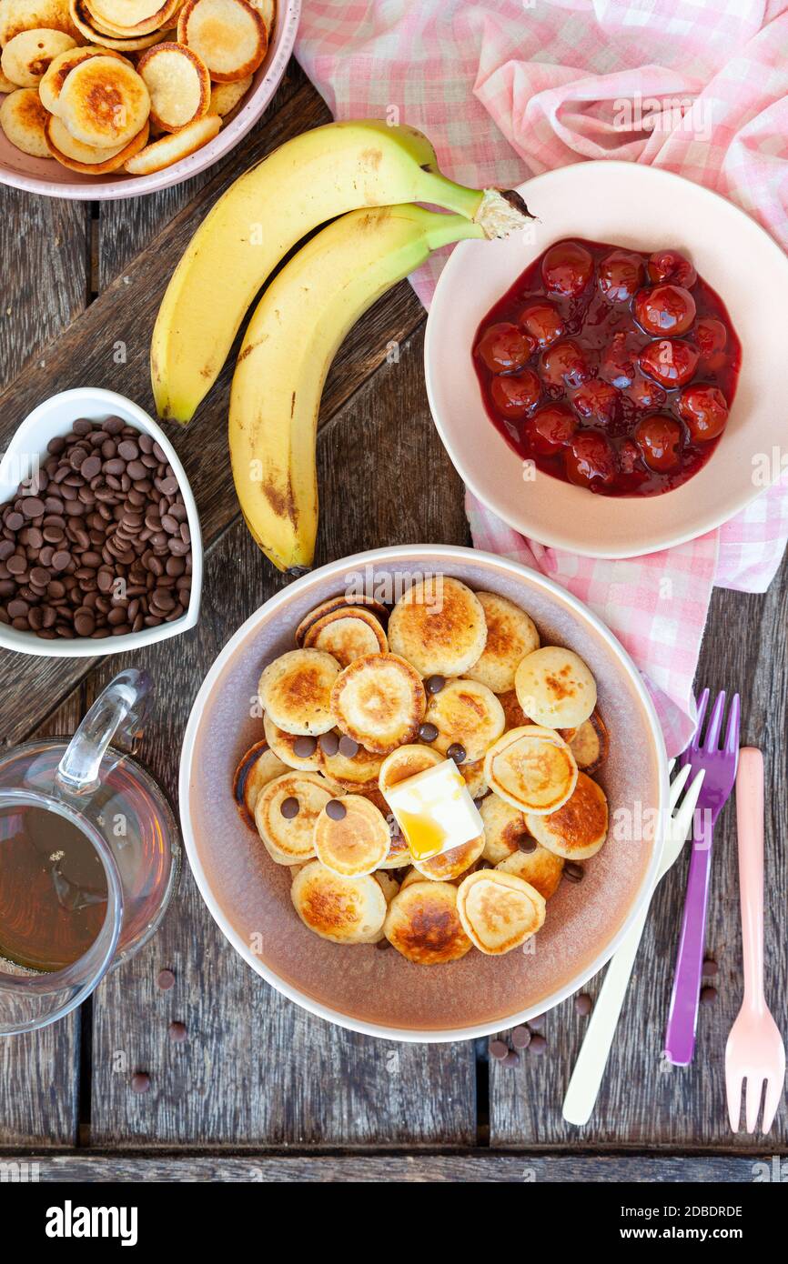 Pancake cereal, mini pancakes in a bowl with maple sirup Stock Photo ...