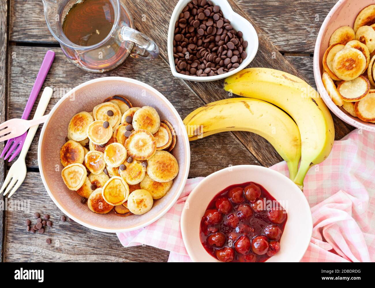 Pancake cereal, mini pancakes in a bowl with maple sirup Stock Photo ...