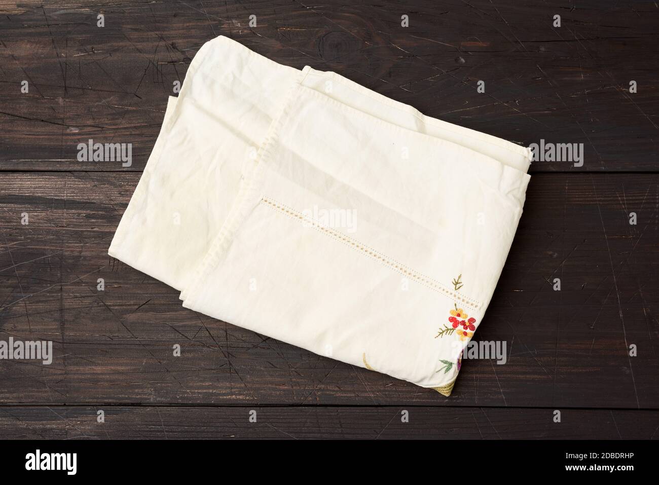 beige kitchen textile towel folded on a gray wooden table from old ...