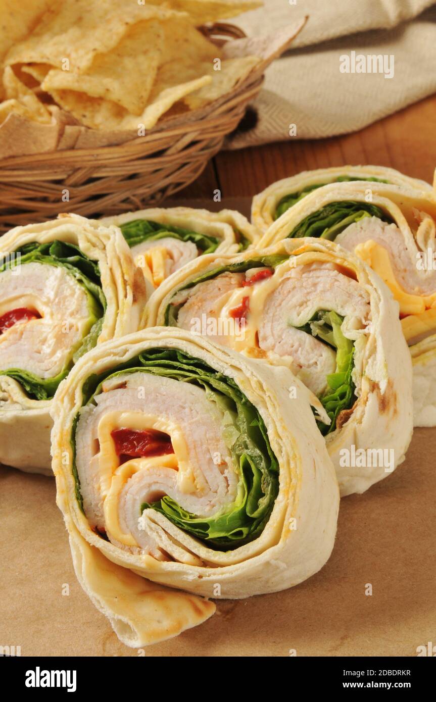 Turkey and cheese wrap sandwiches with tortilla chips Stock Photo - Alamy
