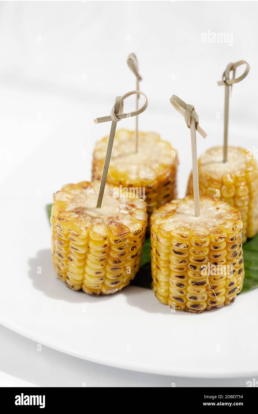 sweet corn on the cob vegetarian tapas snack food Stock Photo - Alamy