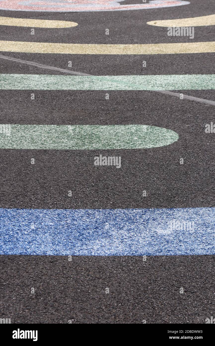 Colored line shapes on asphalt surface texture Stock Photo - Alamy
