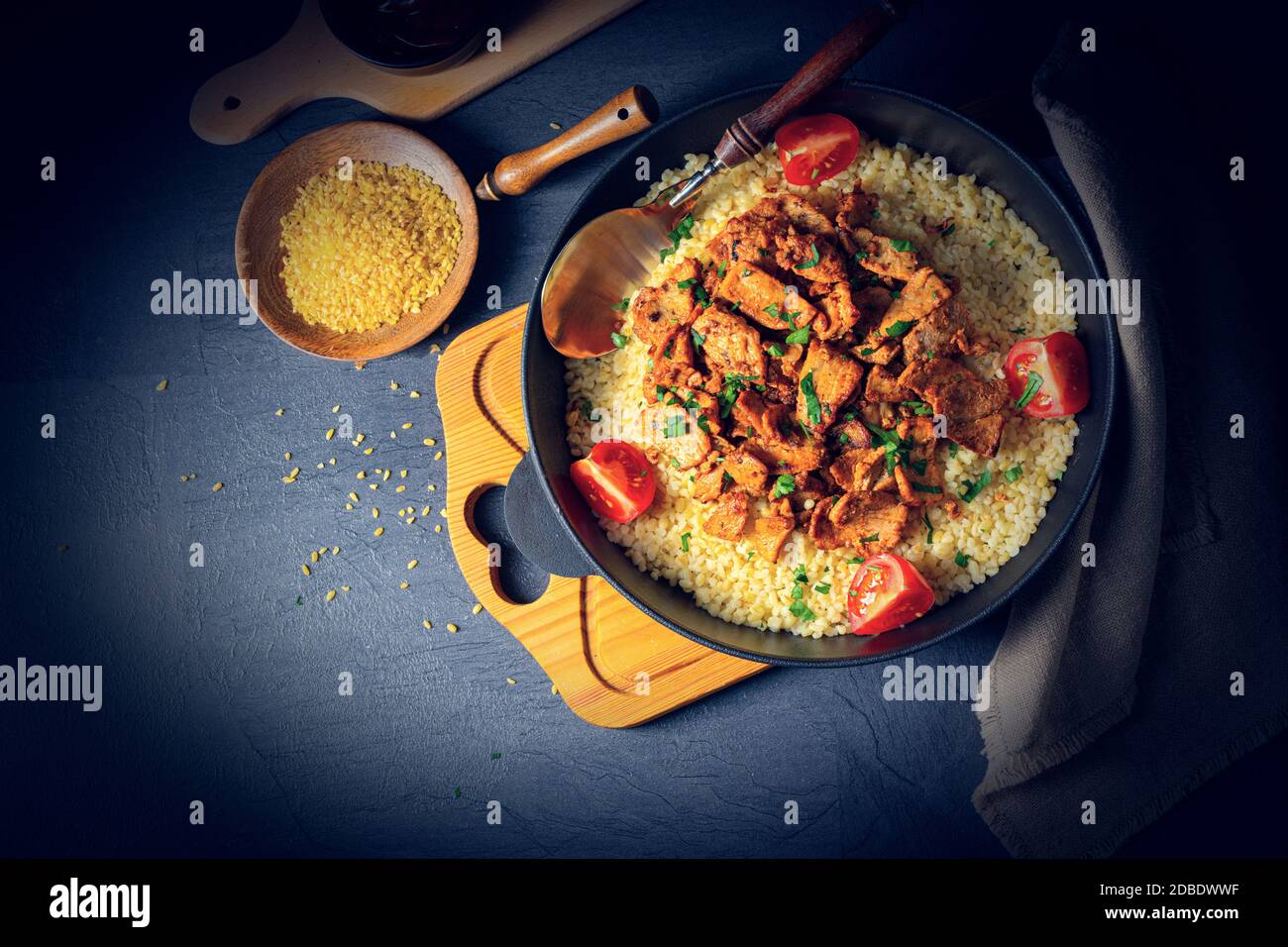 rustic bulgur pans with gratinated gyros and yoghurt Stock Photo - Alamy