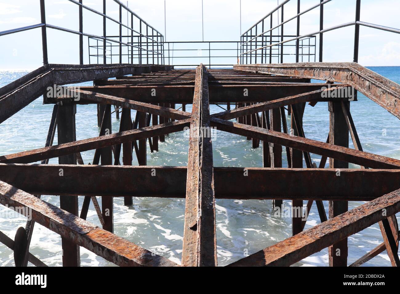 Hard rust pier construction on sea beach Stock Photo - Alamy