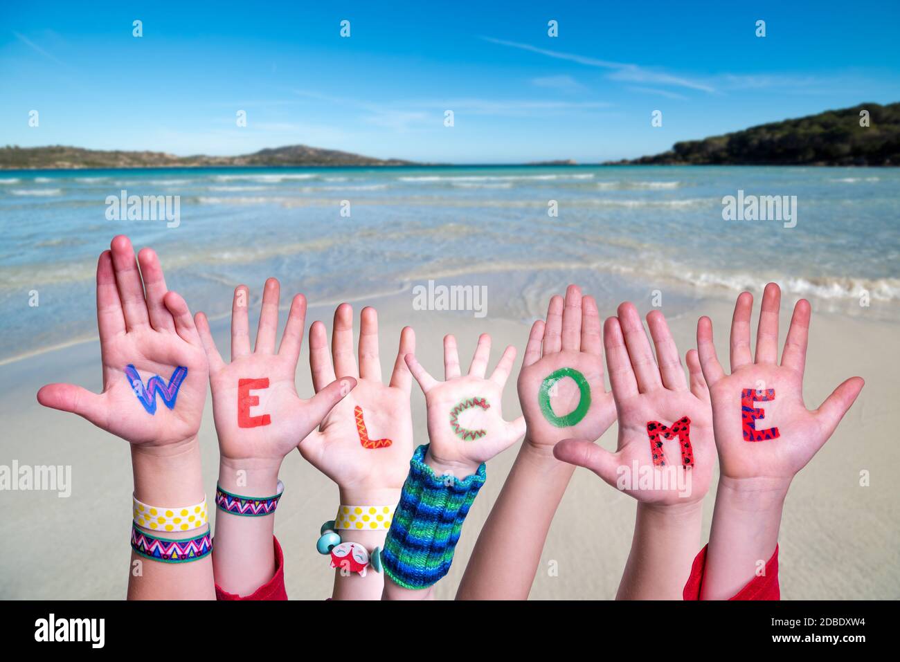 Children Hands Building Colorful Word Welcome. Ocean And Beach As ...