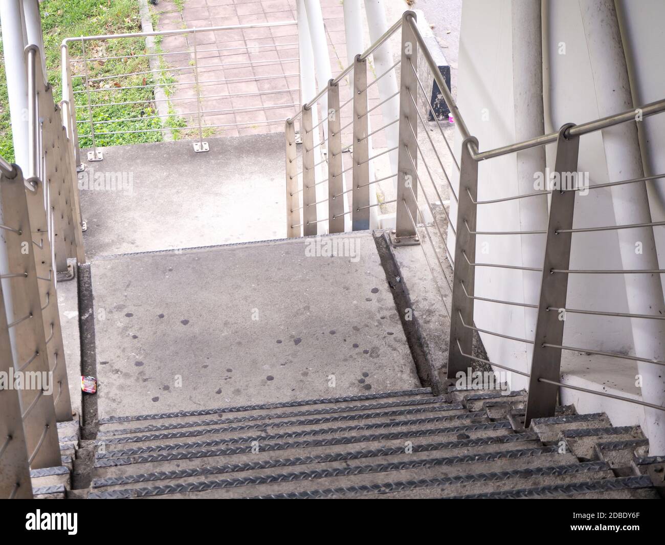 staircase for descending from footbridge. The concrete overpass for ...