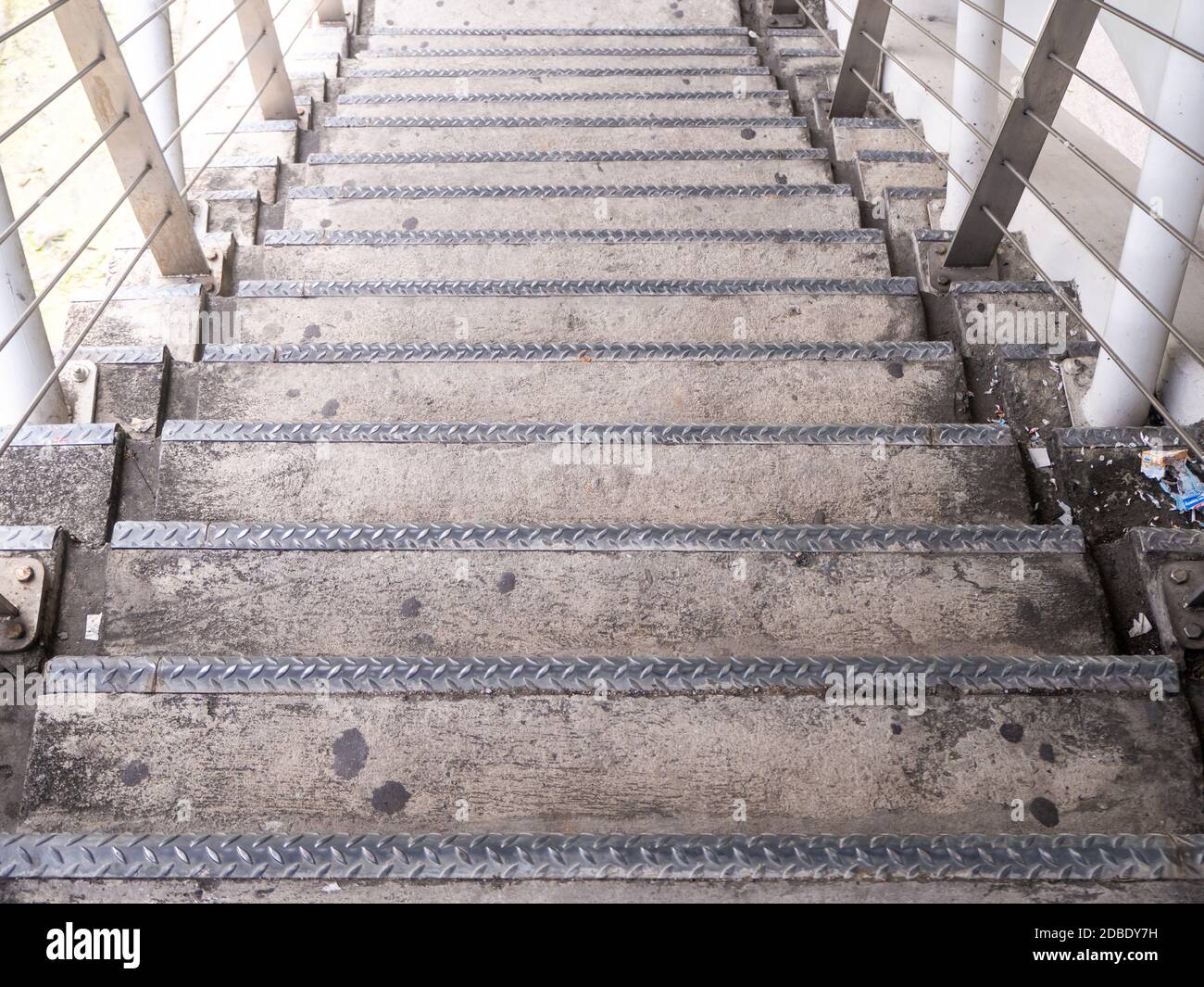 staircase for descending from footbridge. The concrete overpass for ...