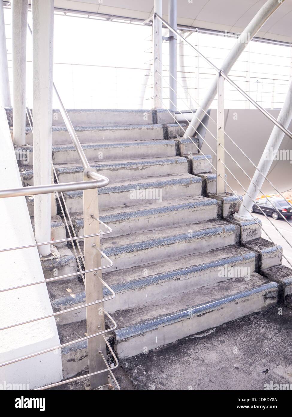 staircase for descending from footbridge. The concrete overpass for ...