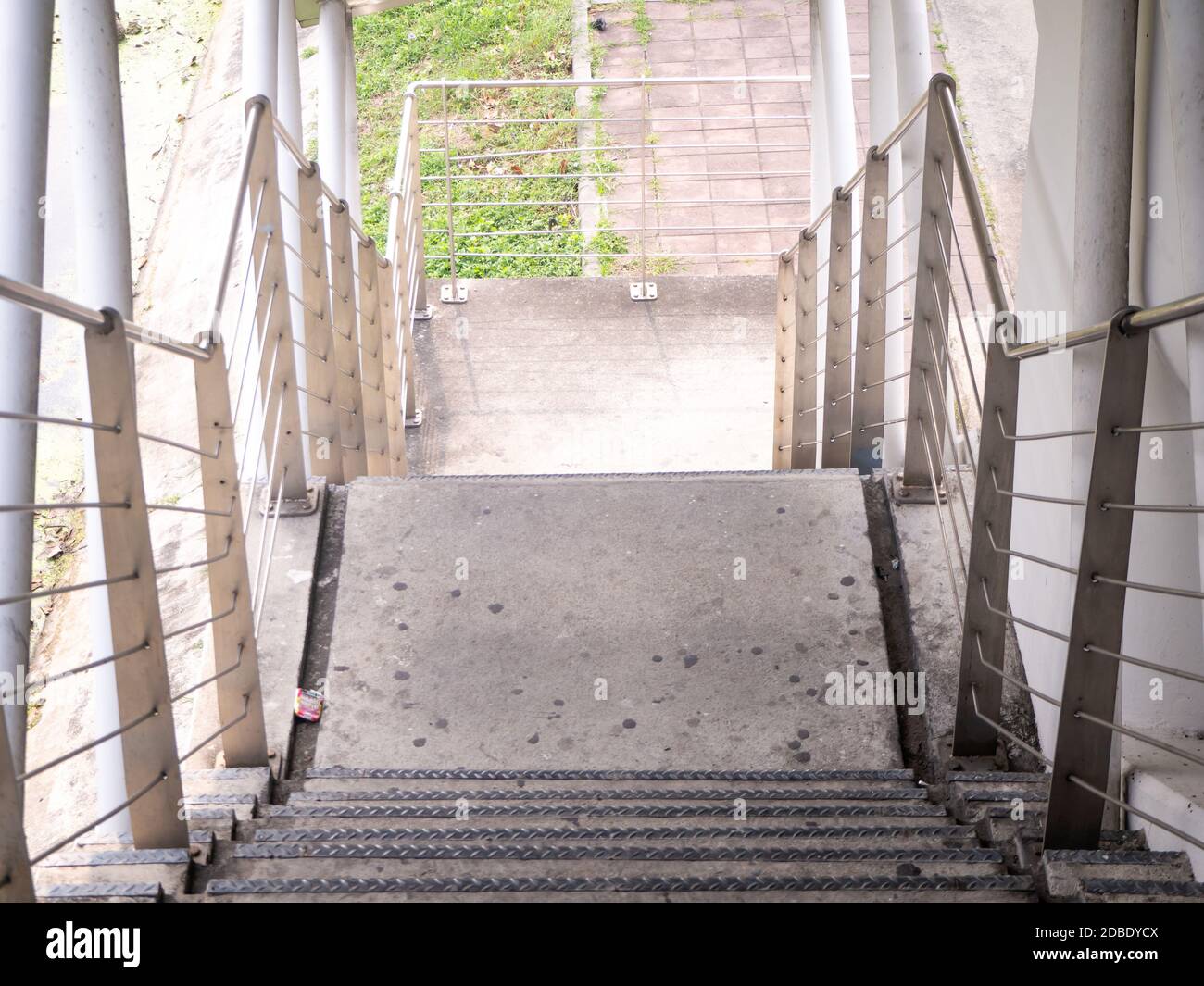 staircase for descending from footbridge. The concrete overpass for ...
