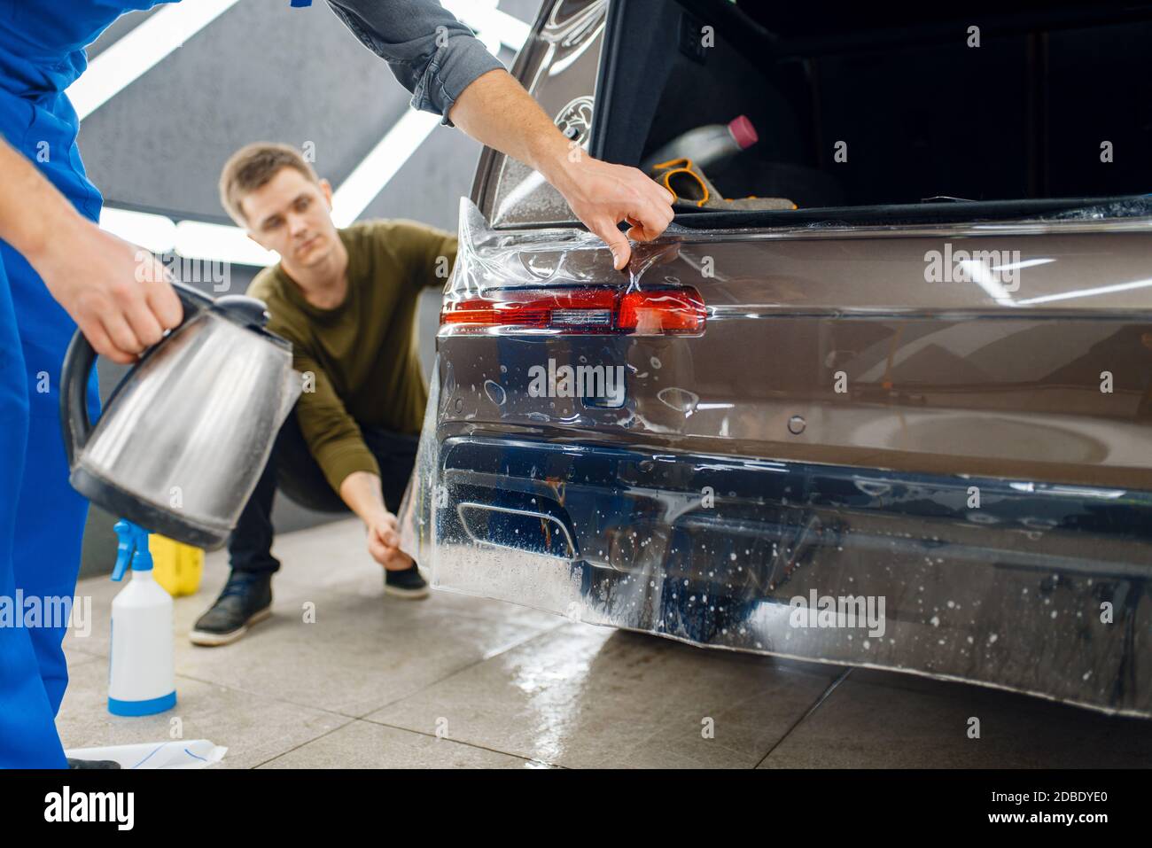 Worker polishing bumper car hi-res stock photography and images - Alamy