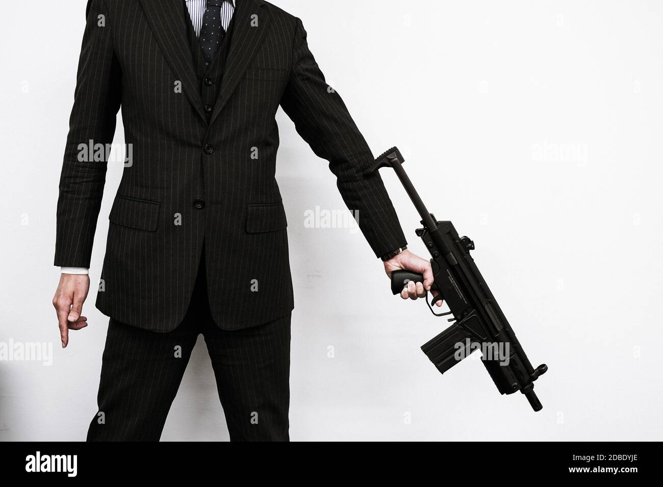 Businessman to fight with a machine gun. Shooting Location: Tokyo ...