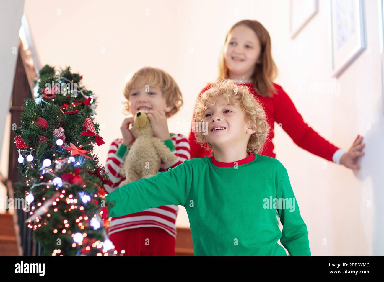 Christmas tree presents family stairs hi-res stock photography and ...