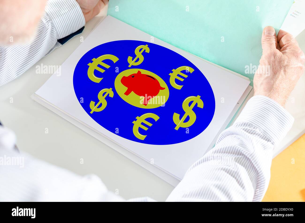 Man holding a file with saving money concept Stock Photo - Alamy