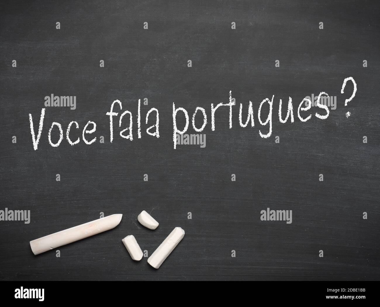 Portuguese text with the words Do you speak Portuguese? on a blackboard ...