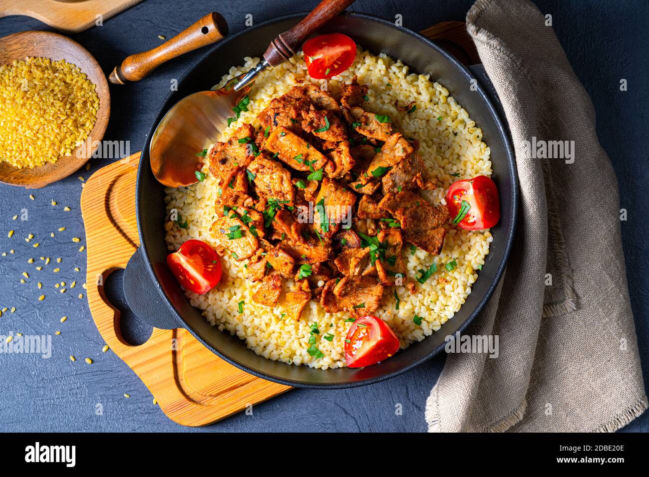 rustic bulgur pans with gratinated gyros and yoghurt Stock Photo - Alamy