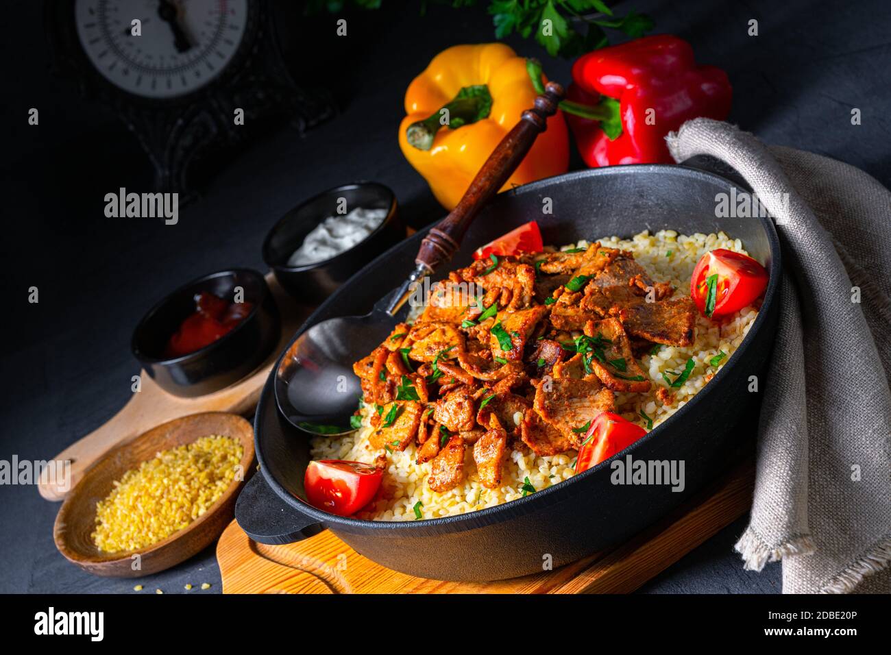 rustic bulgur pans with gratinated gyros and yoghurt Stock Photo - Alamy