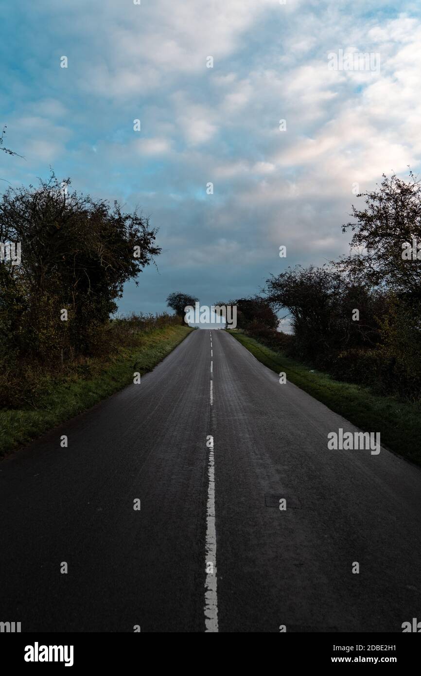 British country road leading to horizon line Stock Photo - Alamy