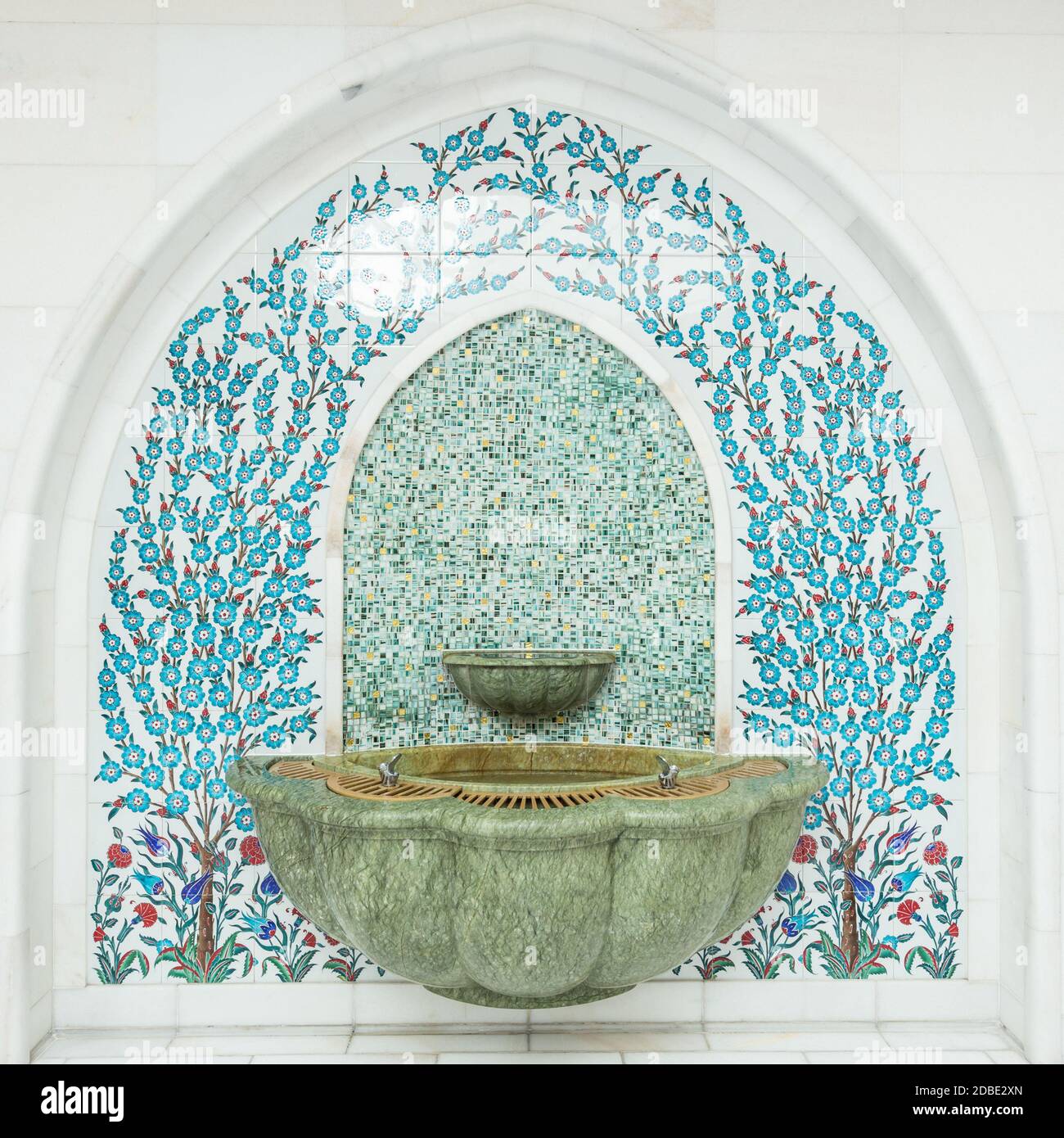Tiled ornament drinking water fountains on forecourt of islamic mosque ...
