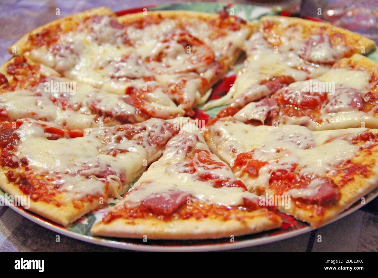 Slices of fresh appetizing pizza with delicious ingredients close up ...
