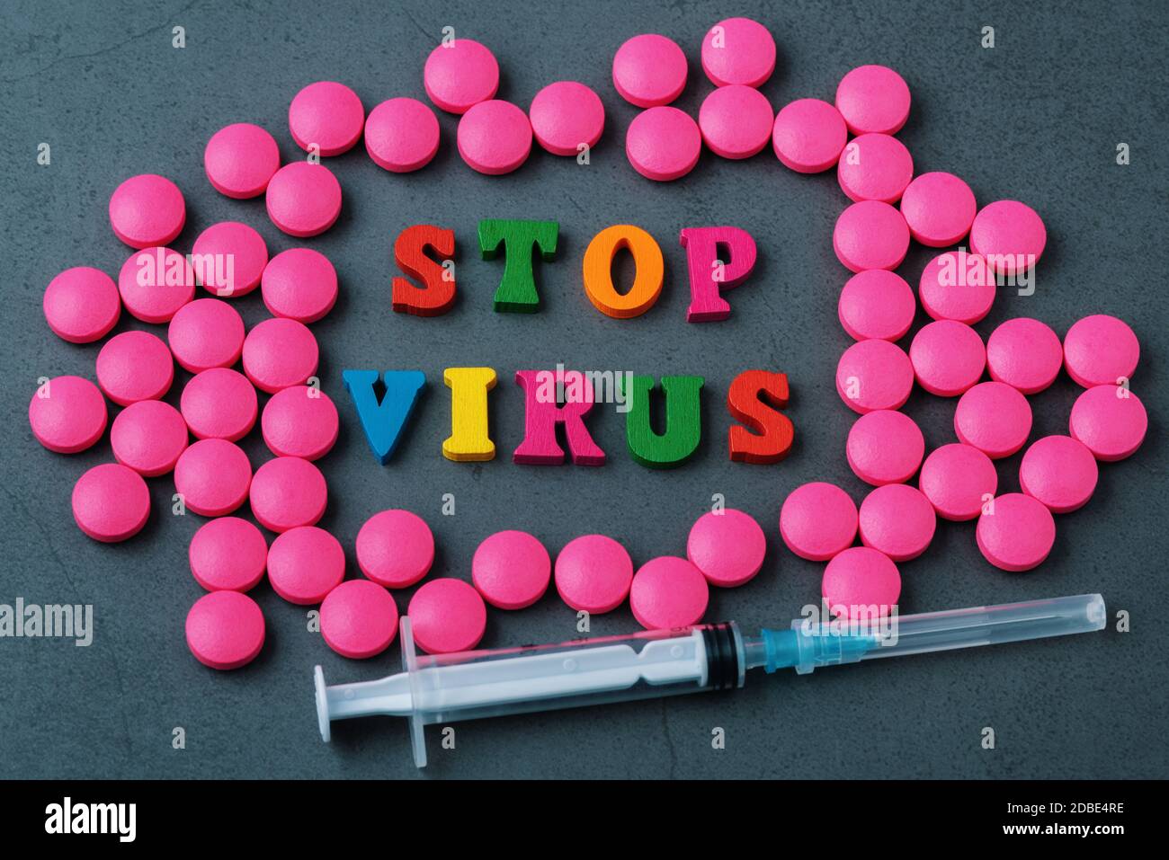 The stop sign consists of multicolored letters in a frame of bright ...