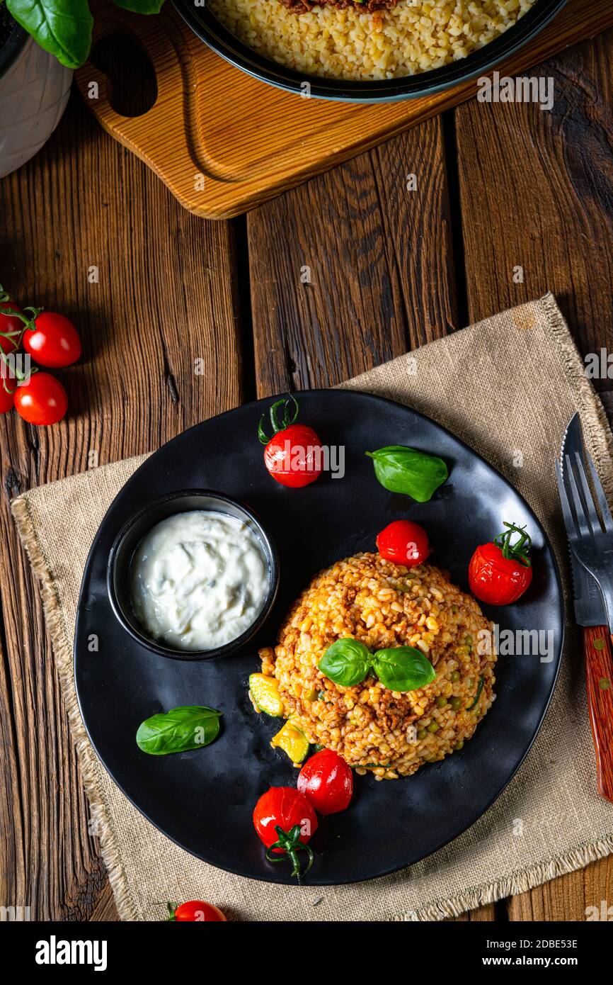 rustic bulgur fried with minced meat and vegetables Stock Photo - Alamy