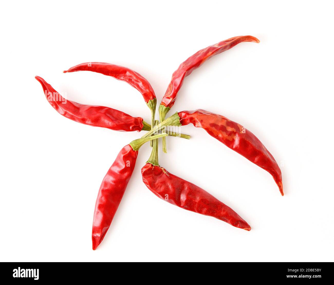 Top view of dried red hot chilli peppers arranged in a star shape on ...