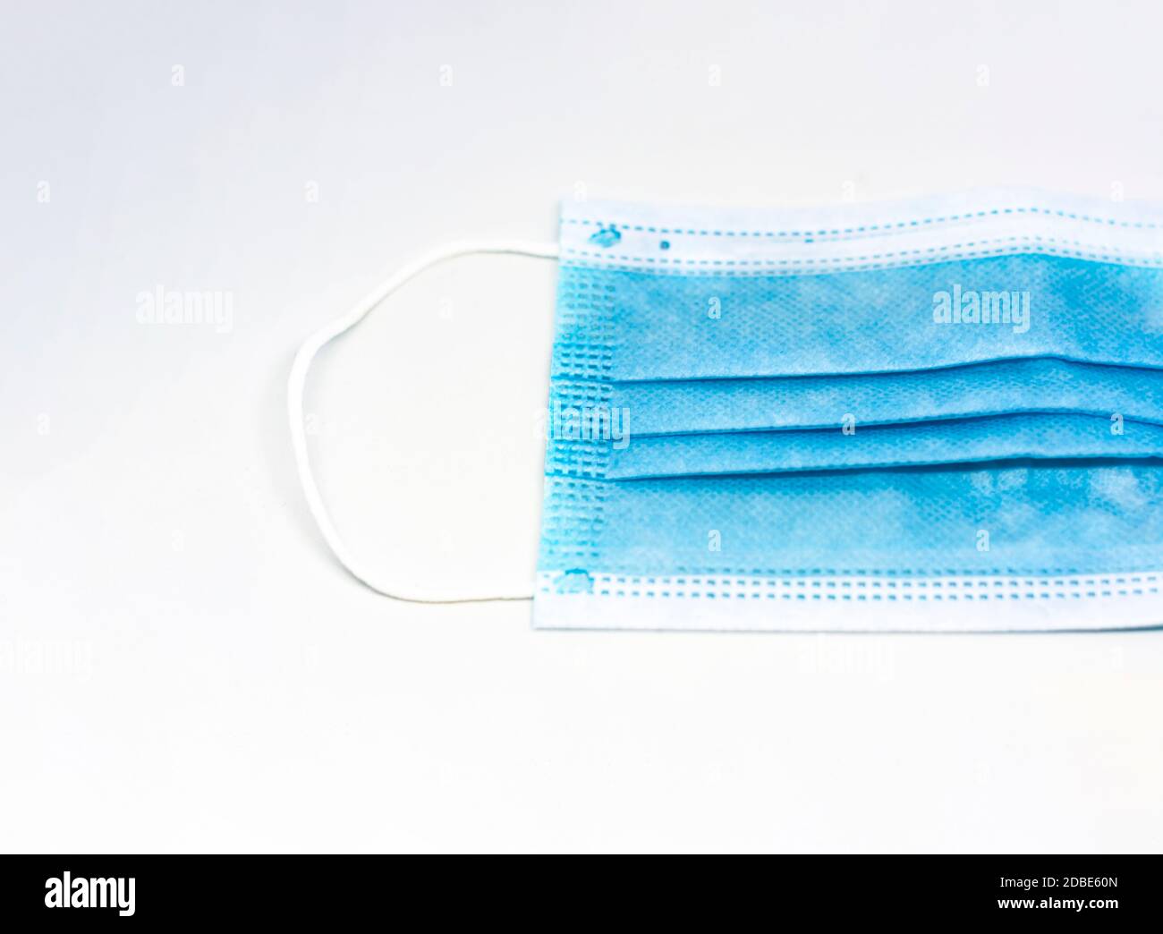 blue surgical mask. Covid-19 pandemic and social distancing to prevent ...