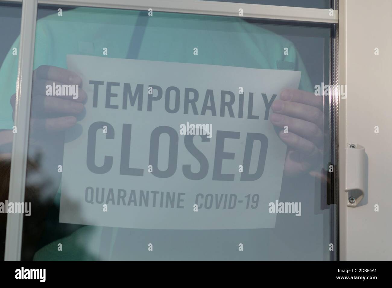 TEMPORARILY CLOSED sign on a frontdoor, Close Up. Restaurant closed due ...