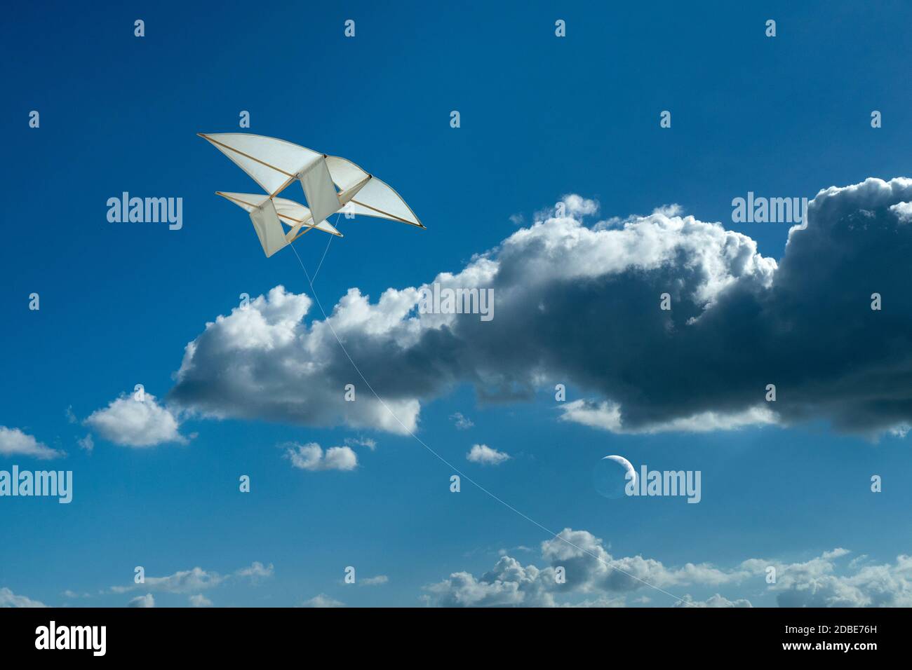 White kite flying, high flying leisure escape concept Stock Photo - Alamy