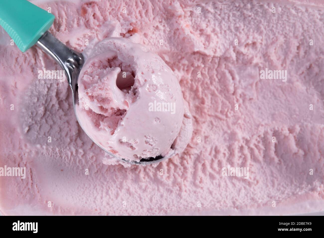 Top view of strawberry flavour ice cream with scoop closeup Stock Photo ...