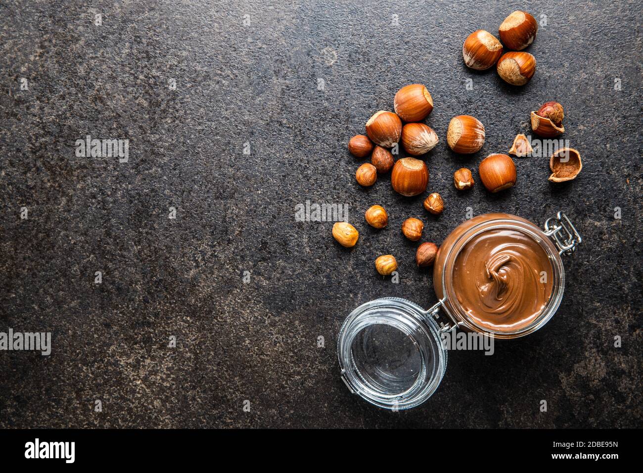 Sweet hazelnut spread. Chocolate cream in jar. Top view Stock Photo - Alamy