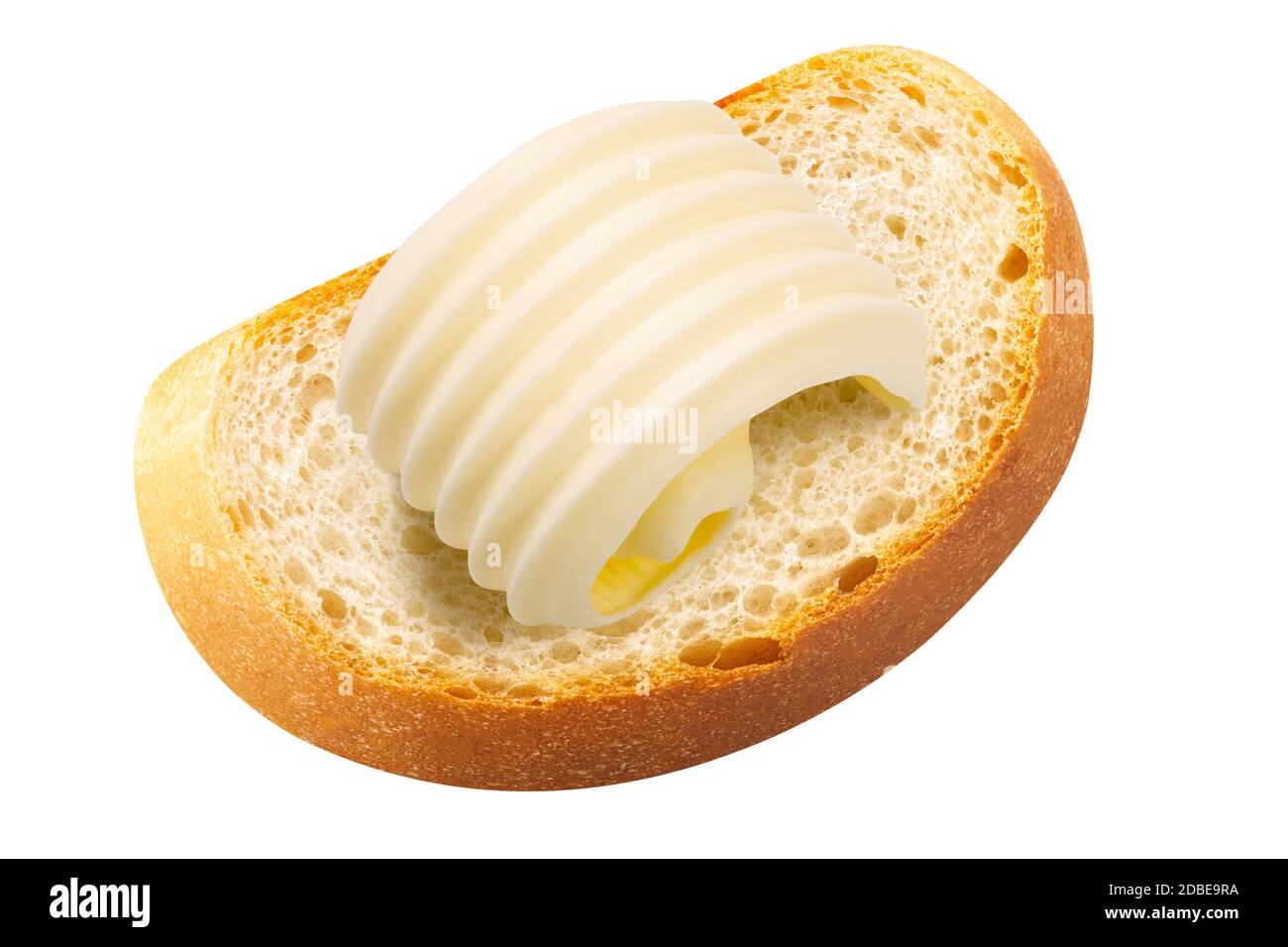 Bread baguette slice with butter curl atop, isolated, top view Stock ...