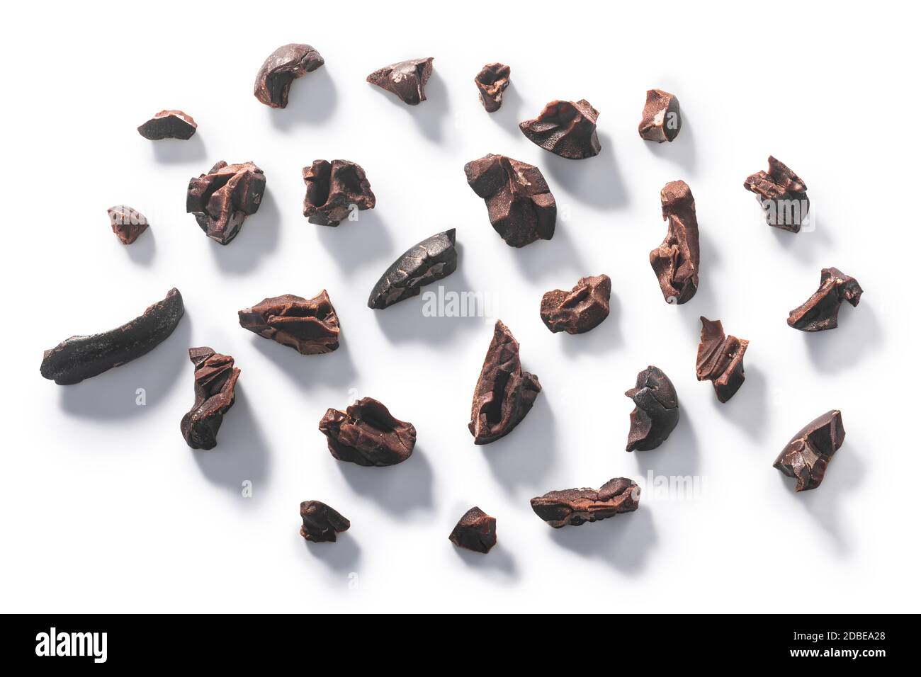 Cacao nibs, a pieces of broken cocoa beans isolated, top view Stock ...