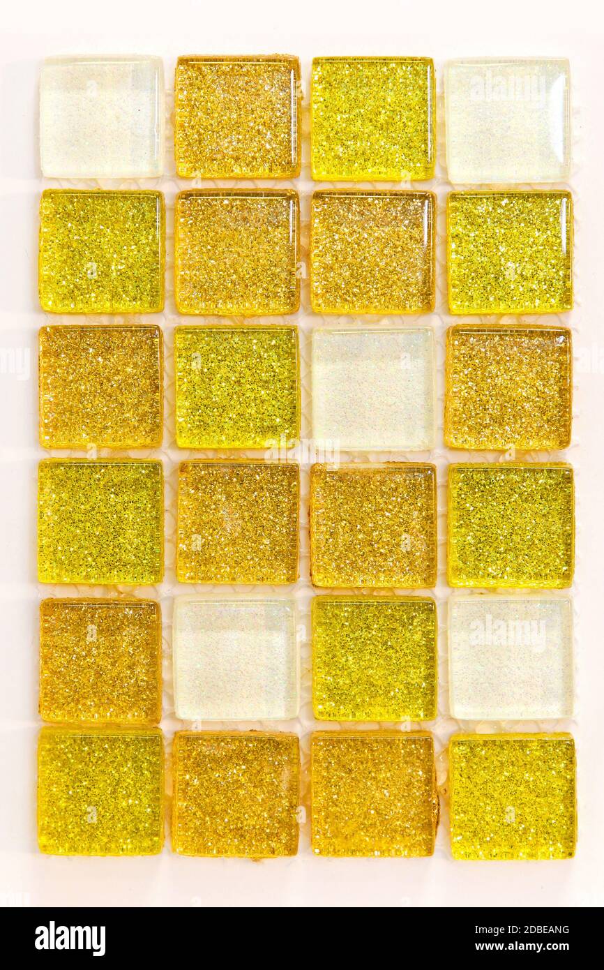 Small glass square tiles in metallic gold Stock Photo - Alamy