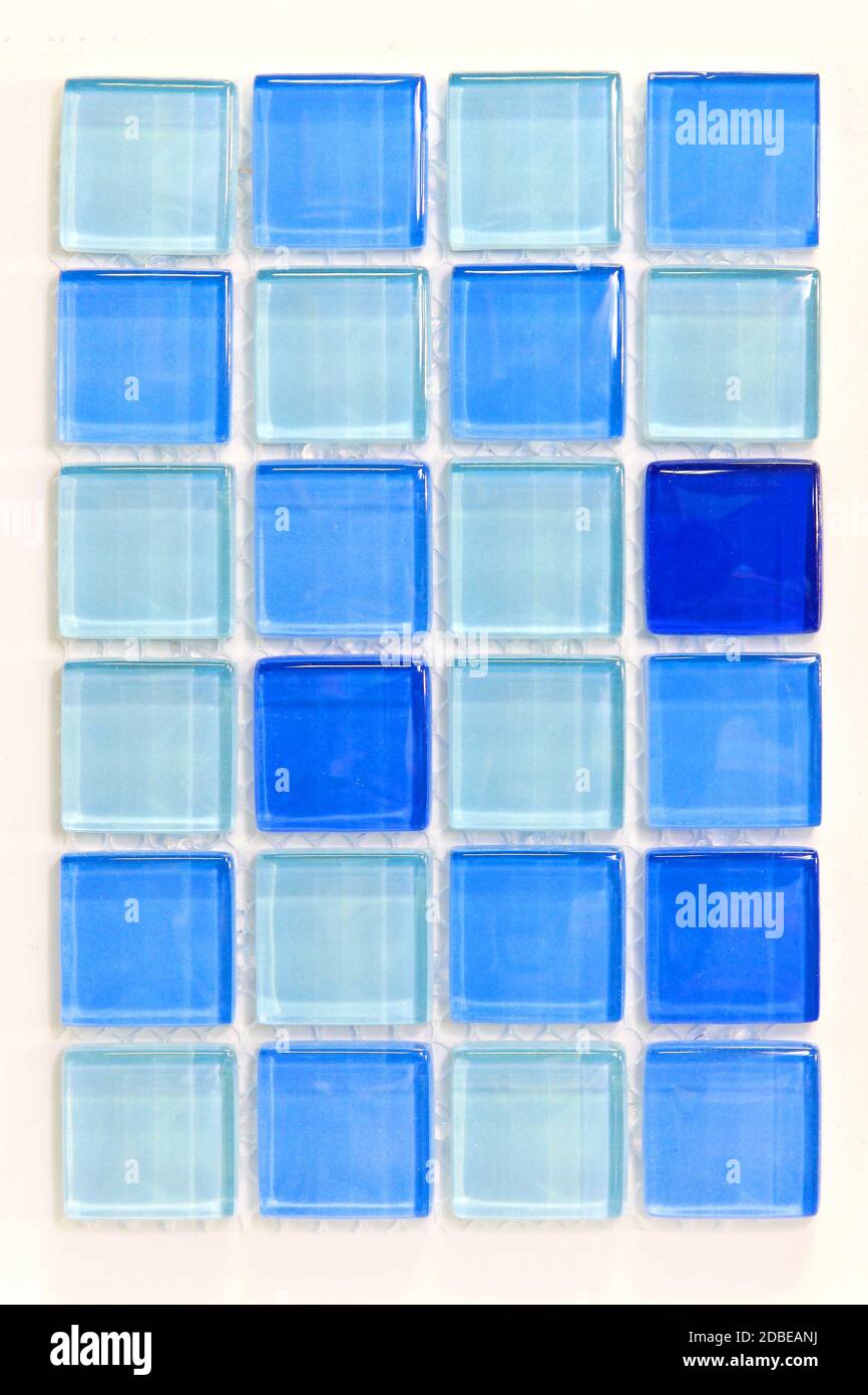 Small glass square tiles in blue colors Stock Photo - Alamy