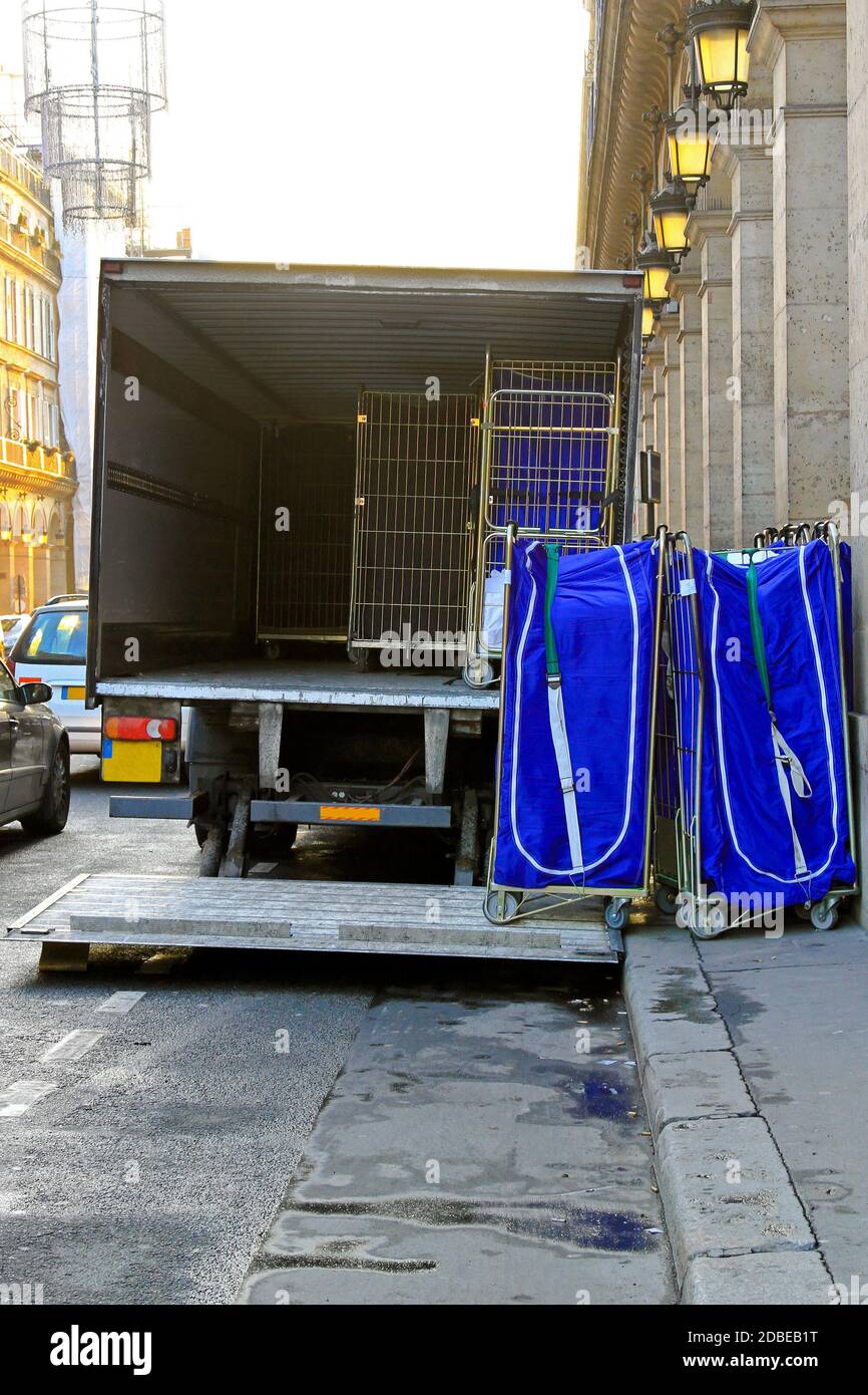 Clean laundry delivery truck with lift ramp Stock Photo - Alamy
