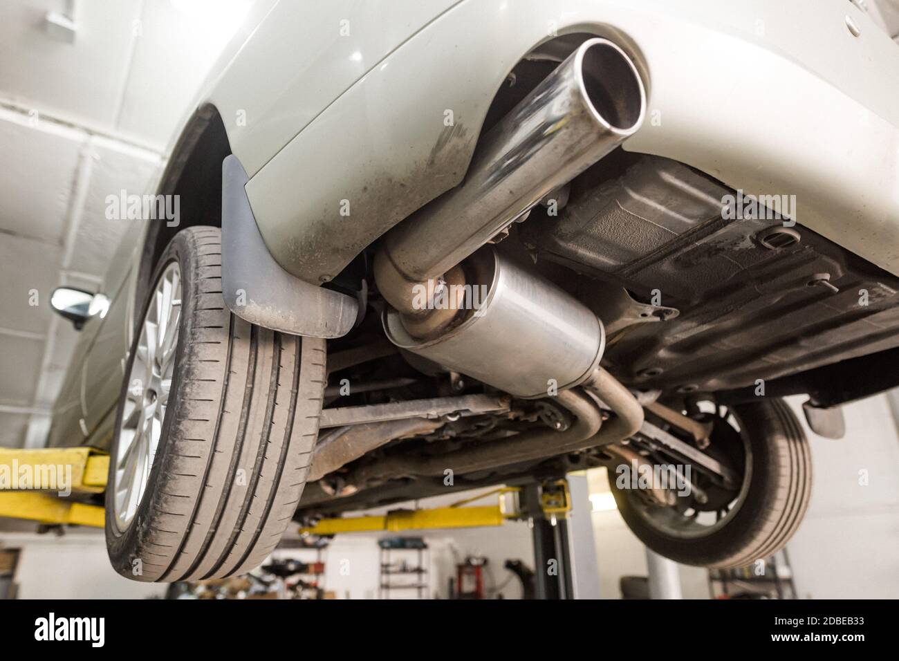 Close up of car exhaust system pipe at garage, automotive car service ...