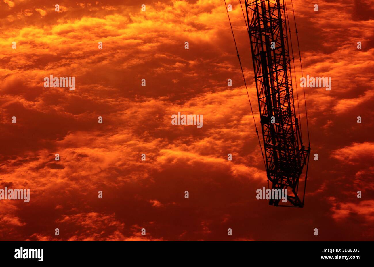 Sunset and a crane Stock Photo - Alamy