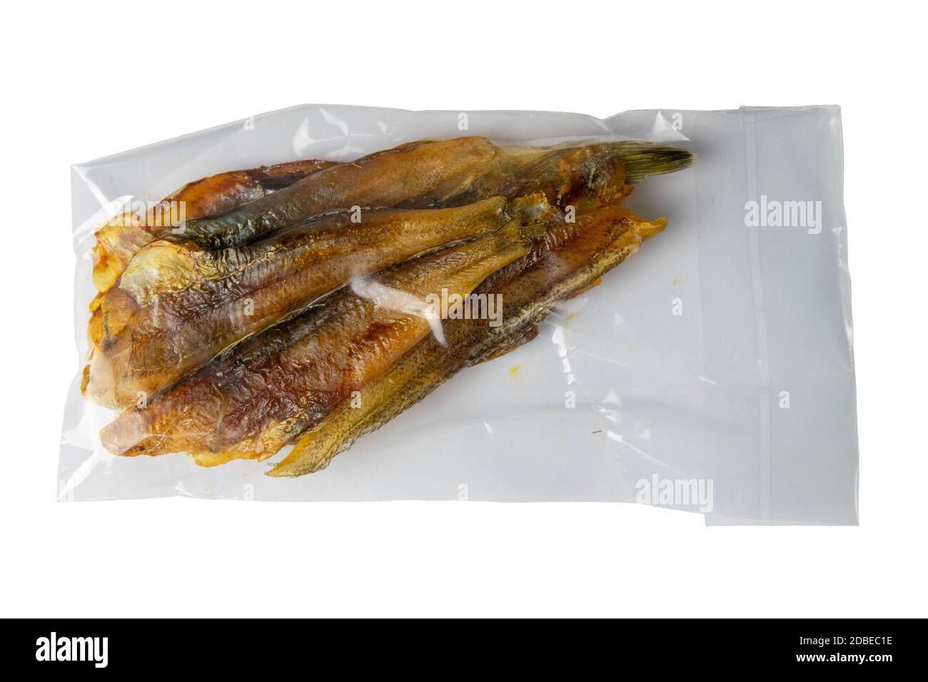 Dried blue whiting fish in a transparent package appetizer to beer ...