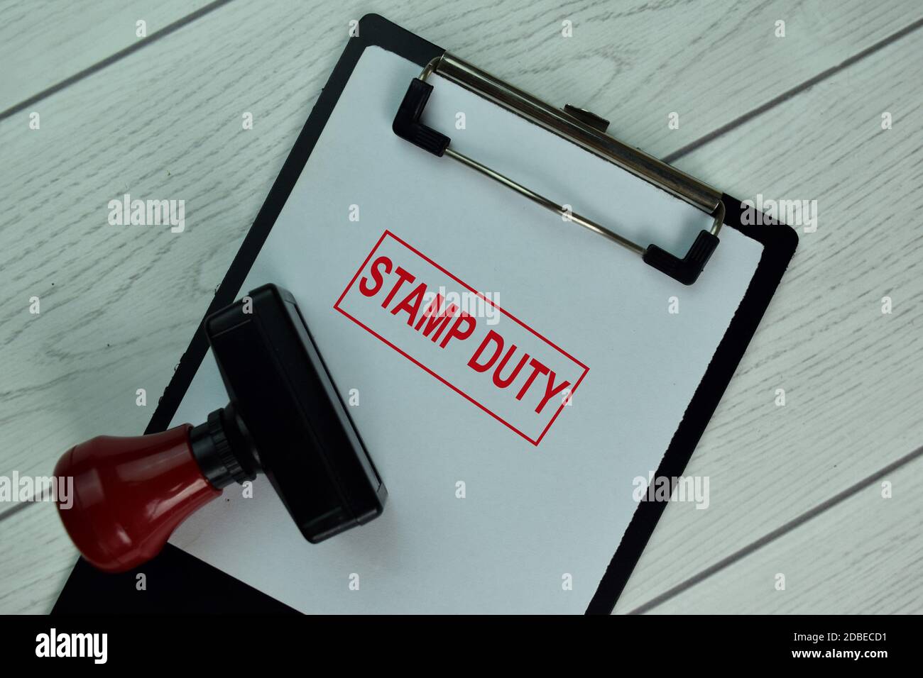 Red Handle Rubber Stamper and Stamp Duty text isolated on the table ...