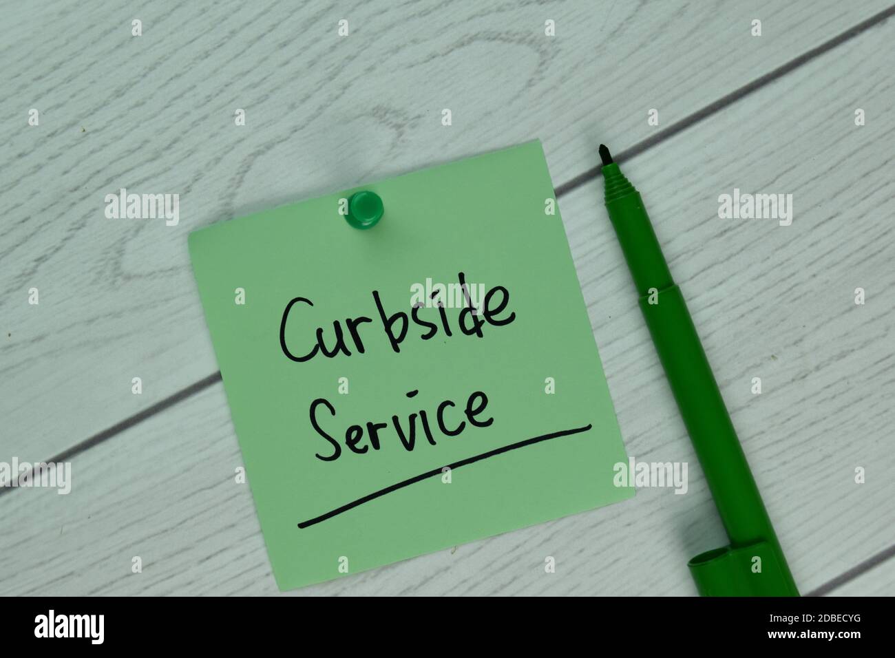 Curbside Service write on sticky note isolated on Wooden Table Stock ...