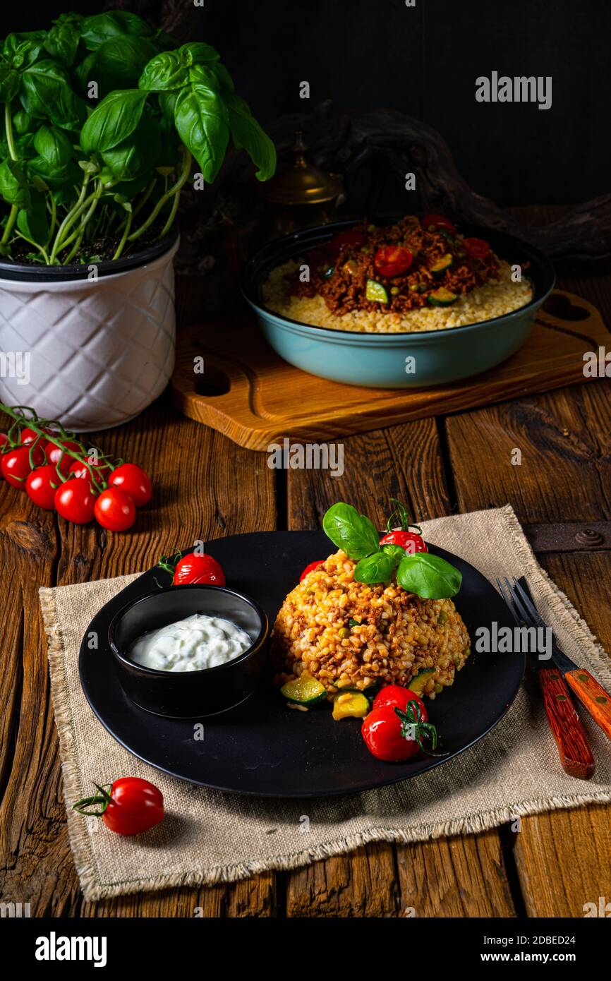 rustic bulgur fried with minced meat and vegetables Stock Photo - Alamy